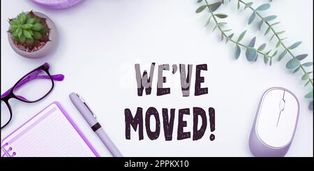 Hand writing sign We'Ve Moved. Business idea going to live from place ...