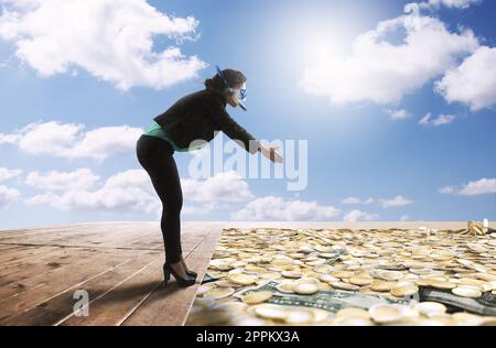 Businesswoman is ready to dip in a big swimming pool full of coin and ...