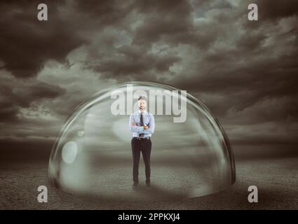 Businessman safely inside a shield dome in the city at night ...