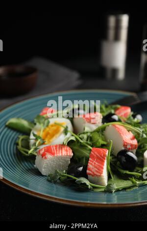 Salad with crab sticks on blue wooden background Stock Photo - Alamy