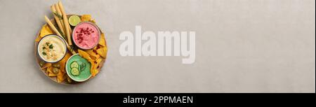 Different kinds of tasty hummuses on white background, top view. Banner ...