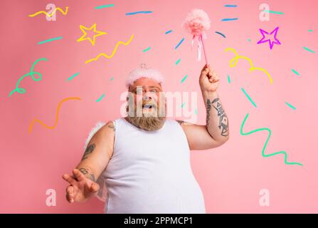 Fat happy man with beard ,tattoos and wings acts like an magic fairy ...