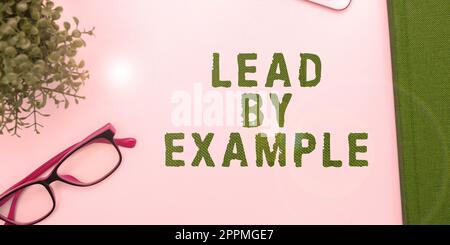 Hand writing sign Lead By Example, Business concept Leadership ...