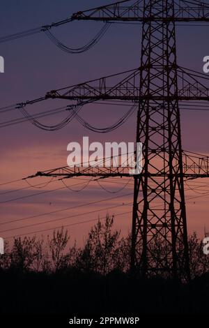 Utility pole during a magnificent sunset electricity Stock Photo - Alamy