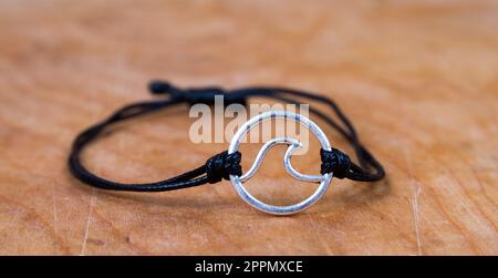 Bead bracelet on the wooden table Stock Photo - Alamy