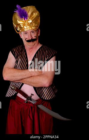 An elder sultan or shiek with a sword isolated over black Stock Photo ...