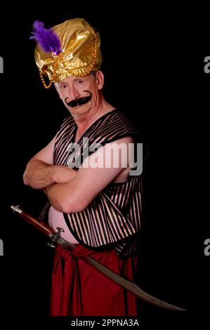 An elder sultan or shiek with a sword isolated over black Stock Photo ...