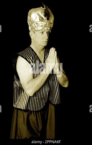 An elder sultan or shiek isolated over black Stock Photo - Alamy