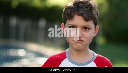 Child changing emotions, going from happy to upset and sad Stock Photo ...