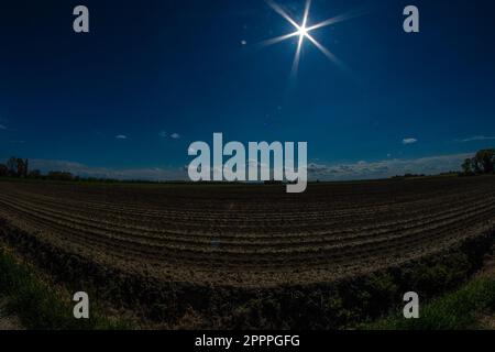 Background of sky, clouds and field with fallow Stock Photo - Alamy