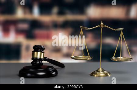 Shiny golden balanced scale and wooden gavel in law firm or lawyer ...