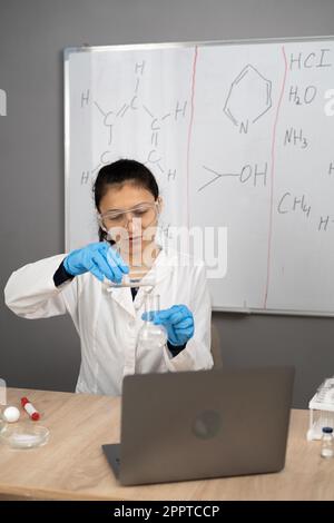 chemistry teacher with laptop having online class Stock Photo - Alamy
