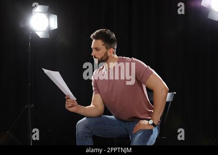 Professional actor reading his script during rehearsal in theatre Stock ...