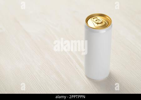 Aluminum 330 ml slim can on the white wood table. Mock-up for design ...