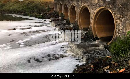Sewage water flowing into river body and polluting the water and ...