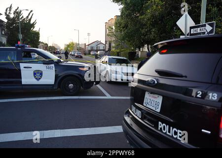 Police officers use a cop vehicle and a cordon line to blockade the ...