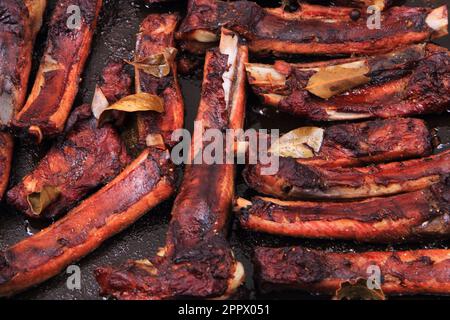 smoked pig ribs as very nice food background Stock Photo - Alamy