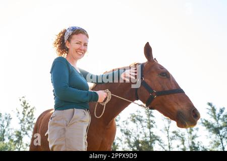 Mature female rancher outdoors Stock Photo - Alamy