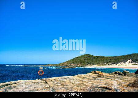 Lifebuoy on a rock by the sea. William Bay National Park, Western ...