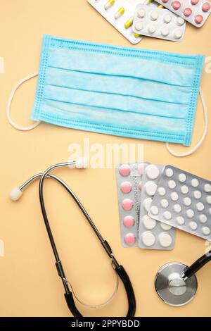 Composition with medical stethoscope, disposable face masks, pills on ...
