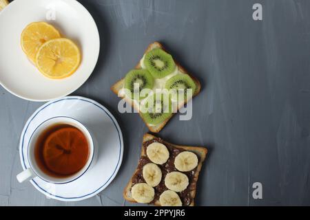 Tasty donut and kiwi slices on color background Stock Photo - Alamy