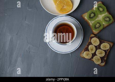 Tasty donut and kiwi slices on color background Stock Photo - Alamy