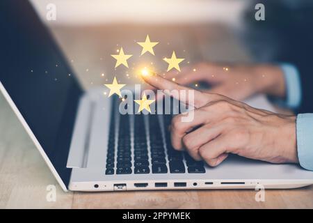 Customer satisfaction. Businessman reviews with notebook (Laptop ...