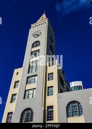 A grand historical structure stands illuminated at night, showcasing ...