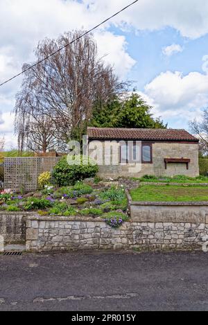 Nunney Castle and moat in the village of Nunney. Built in the 1370s by ...