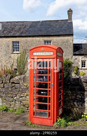 Old english phone booth in a garden Stock Photo - Alamy