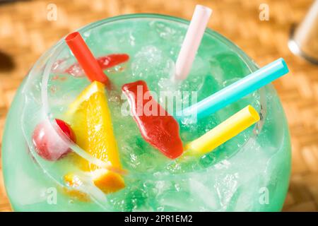 Boozy Cold Blue Tiki Fishbowl Cocktail with Orange and Rum Stock Photo ...