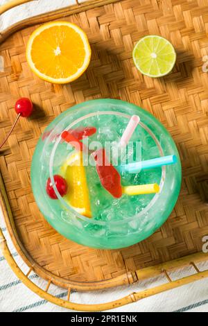 Boozy Cold Blue Tiki Fishbowl Cocktail with Orange and Rum Stock Photo ...