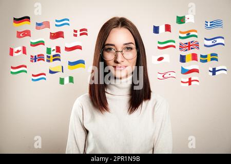 Portrait of interpreter and flags of different countries on grey ...