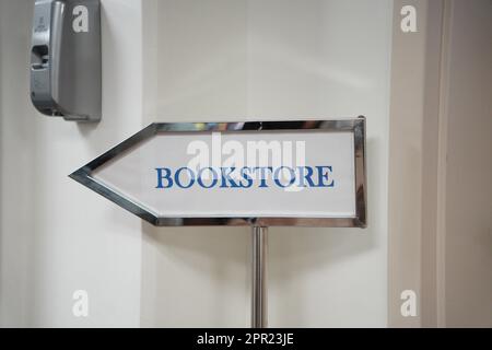 Bookstore sign inside the school or university. Bookstore arrow signs ...