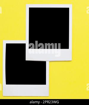 Polaroid photo frames on yellow background Stock Photo - Alamy
