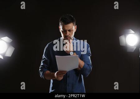 Professional actor reading his script during rehearsal in theatre Stock ...