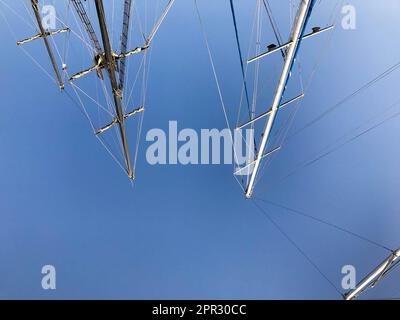 A mast, a vertically standing structure on a ship supported by braces ...