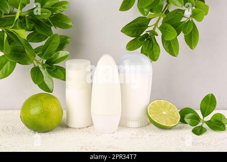 Deodorant and lime on light table Stock Photo - Alamy