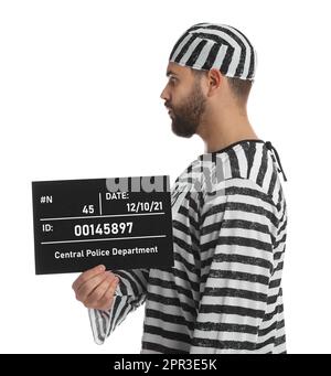 Prisoner with mugshot letter board on white background Stock Photo - Alamy