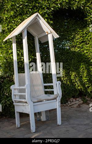 traditional wooden roofed chair for a watchmen Stock Photo - Alamy
