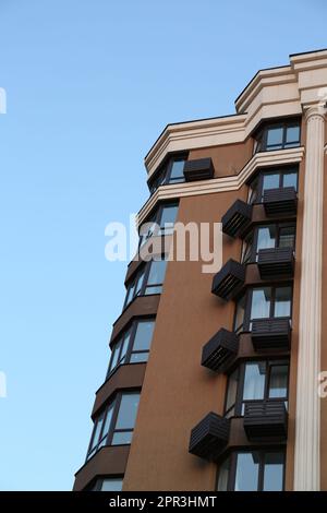 High angle view of multistory stone cladded houses and apartment ...