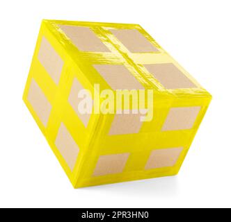 Cardboard parcel box with yellow sticky tape on white background Stock ...
