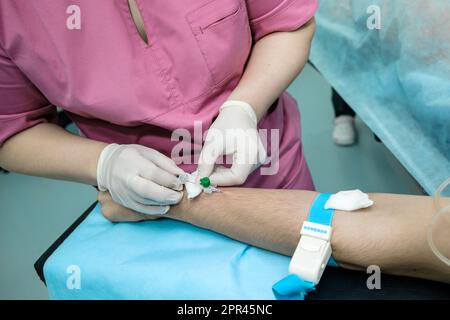 Placement of a catheter in the patient's arm for intravenous ...
