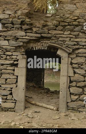 Abandoned medieval stone window archway surrounds Stock Photo - Alamy