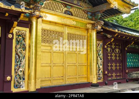 The ornate wooden Karamon gate and ascending dragon carving at the Ueno ...
