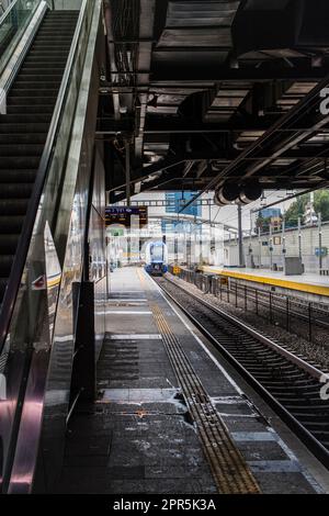 Train coming when people waiting for transportation, TACHiKAWA Japan ...