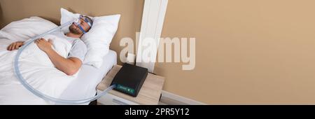 Man With Sleeping Apnea And CPAP Machine Stock Photo - Alamy