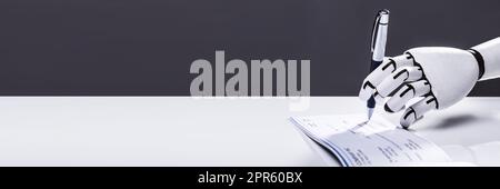 A robotic arm holding a pen Stock Photo - Alamy