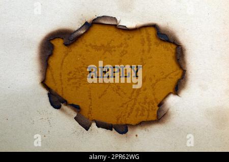 Reply text on paper hole grunge concept Stock Photo - Alamy