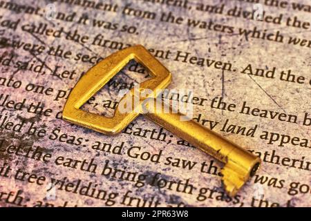 Key on Bible Page Stock Photo - Alamy